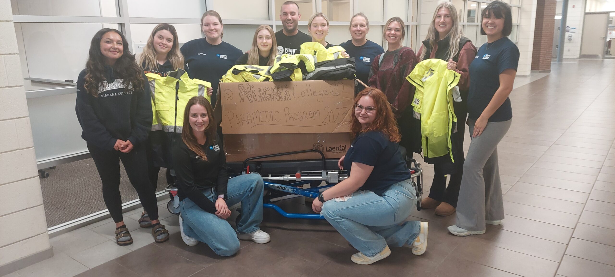 Paramedic students lend hands to jacket donation | InsideNC